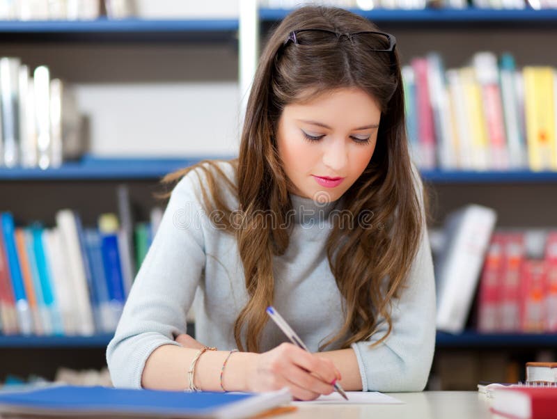 Student Studying in a Library Stock Photo - Image of shelf, happy: 42252398
