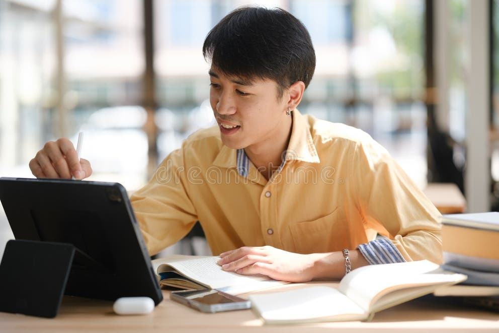 Student Studying Online and Preparing for Exams with Digital Devices ...