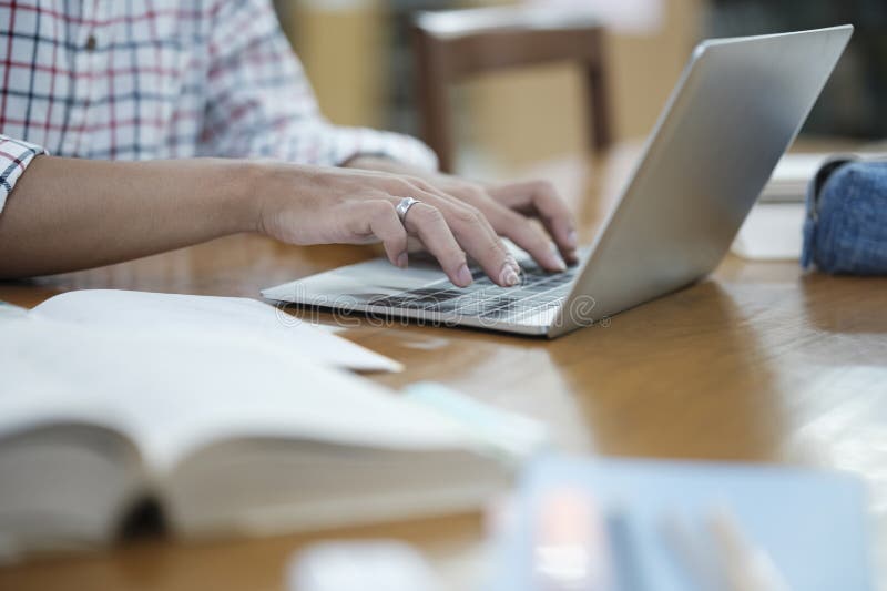 Student Studying Online Using Laptop in Library Stock Photo - Image of ...