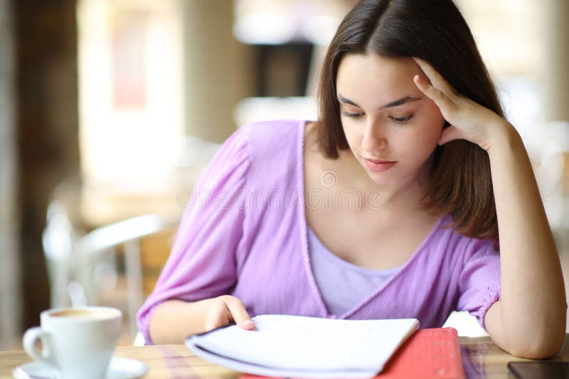 Student Studying Reading Paper Notes in a Bar Stock Image - Image of ...