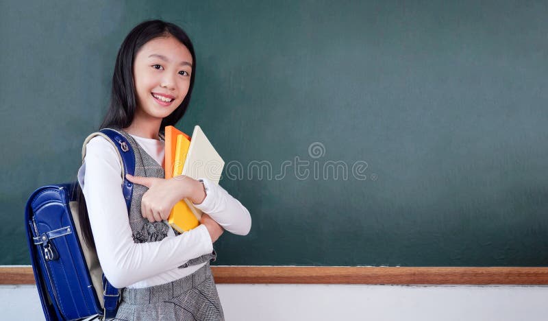 Student Studying and Reading Textbook with Happiness in Classroom Stock ...