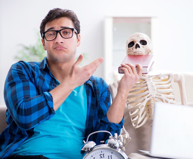 Student Studying with Skeleton Preparing for Exams Stock Photo - Image ...