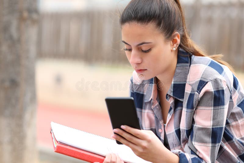 Student Studying Using Notes and Phone Stock Image - Image of read ...