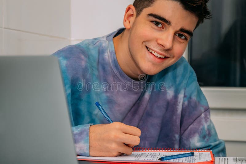 Student at the Table Writing Stock Image - Image of paper, read: 213475549