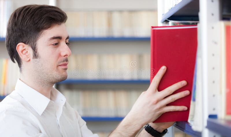 Student Taking a Book in a Library Stock Photo - Image of education ...
