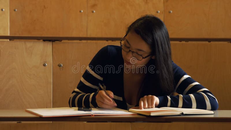 Student taking down notes stock footage. Video of girl - 60991442