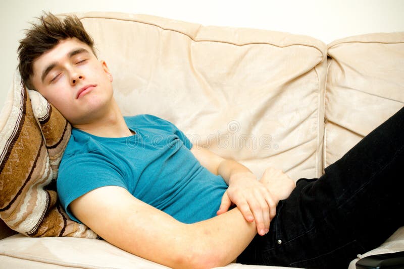 Student sleeping on a sofa stock image. Image of youth - 110110285