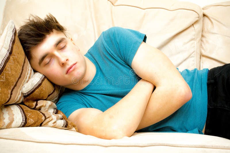Student sleeping on a sofa stock image. Image of university - 110110305