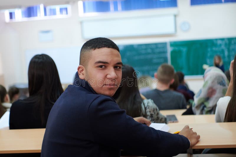 Student Taking Notes while Studying in High School Stock Photo - Image ...
