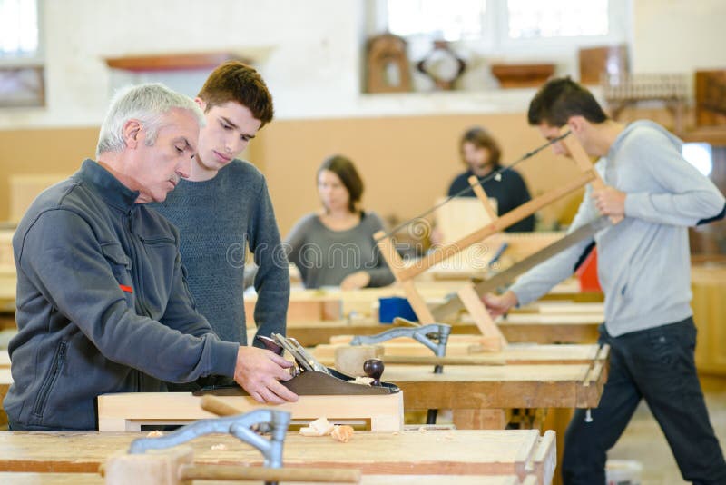 Student and Teacher in Carpentry Class Stock Image - Image of portrait ...