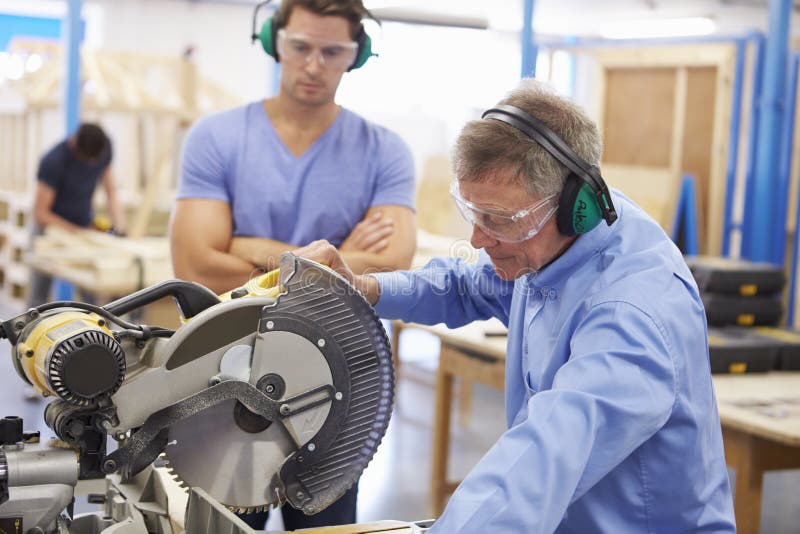 Student and Teacher in Carpentry Class Using Circular Saw Stock Photo ...