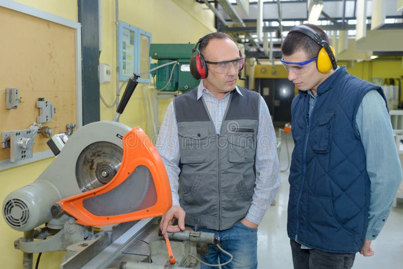 Student and Teacher in Carpentry Class Using Circular Saw Stock Image ...