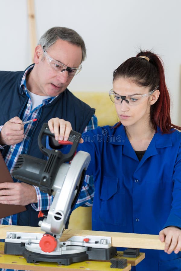Student and Teacher in Carpentry Class Using Circular Saw Stock Photo ...