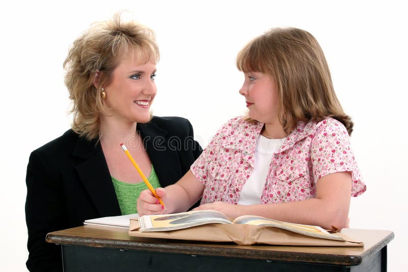 Student And Teacher At Desk Royalty Free Stock Photo - Image: 231525