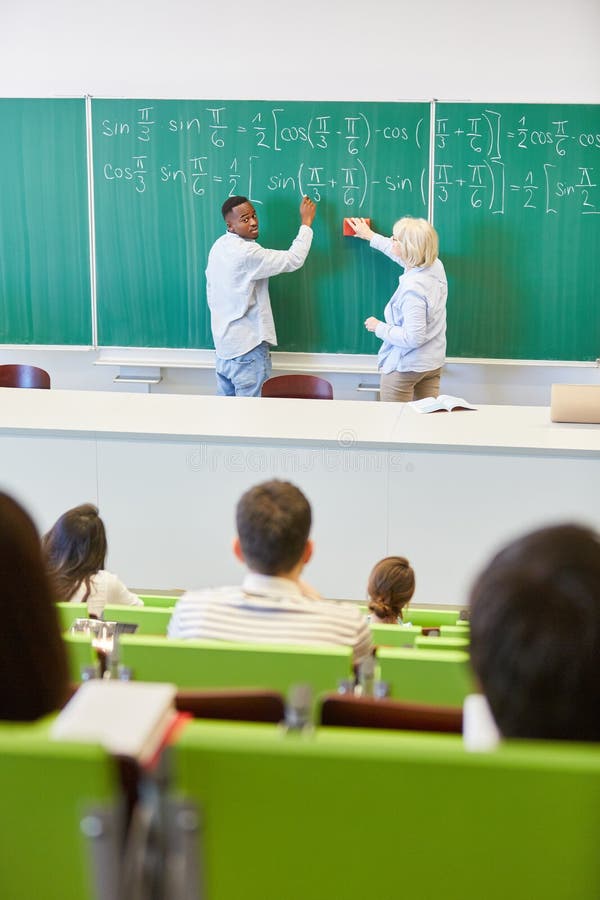 Teacher Writing on Chalkboard Stock Photo - Image of math, primary ...