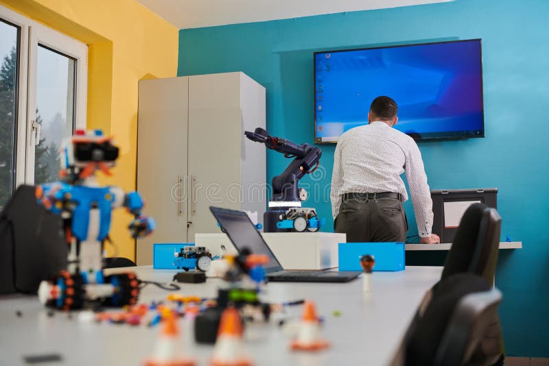 A Student Testing His New Invention of a Robotic Arm in the Laboratory ...