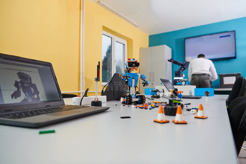 A Student Testing His New Invention of a Robotic Arm in the Laboratory ...