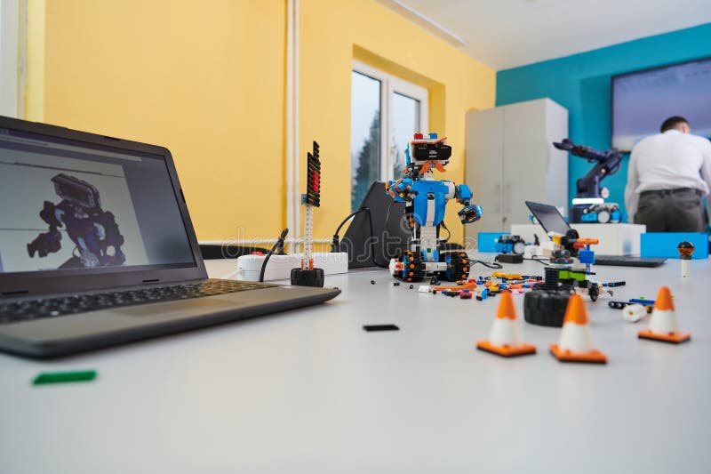 A Student Testing His New Invention of a Robotic Arm in the Laboratory ...