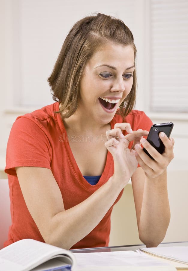 Student Text Messaging on Cell Phone in Classroom Stock Image - Image ...