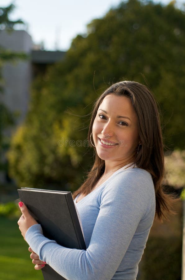 Student with Textbook on Campus Stock Image - Image of education, smile ...