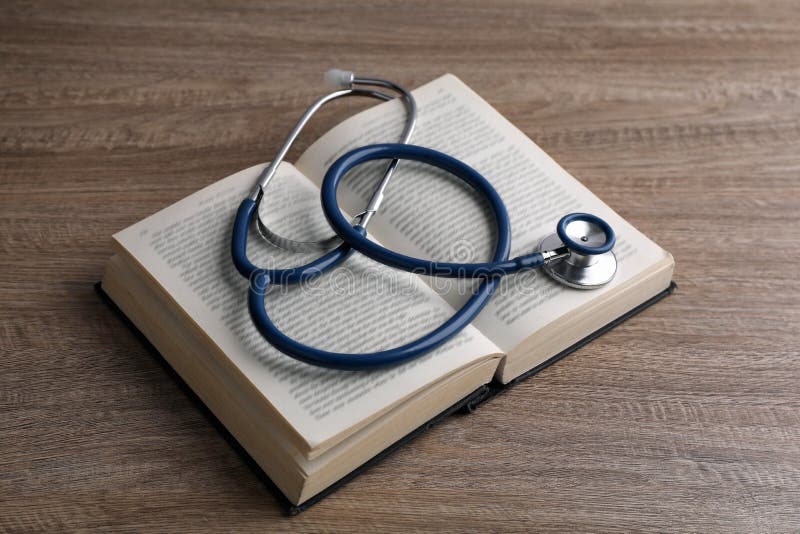 Student Textbook and Stethoscope on Table. Medical Education Stock ...
