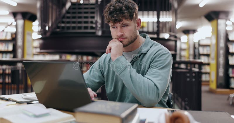 Student, Thinking and Man in Library, Laptop and Typing with Education ...