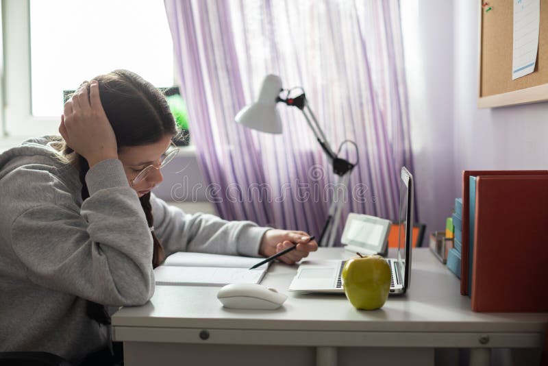 A Difficult School Assignment To Solve. a Teenage Girl Learns. Stock ...