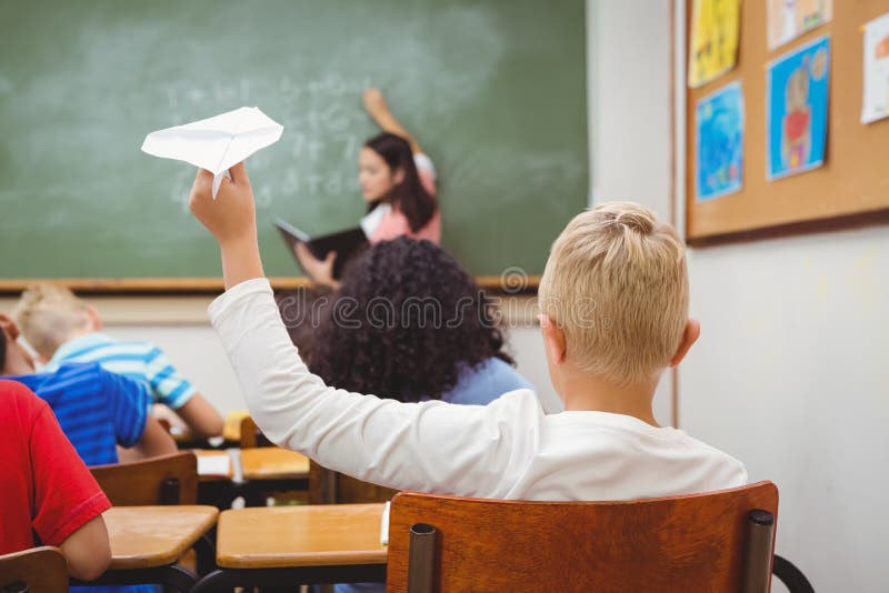 Naughty Pupil about To Throw Paper Airplane in Class Stock Photo ...