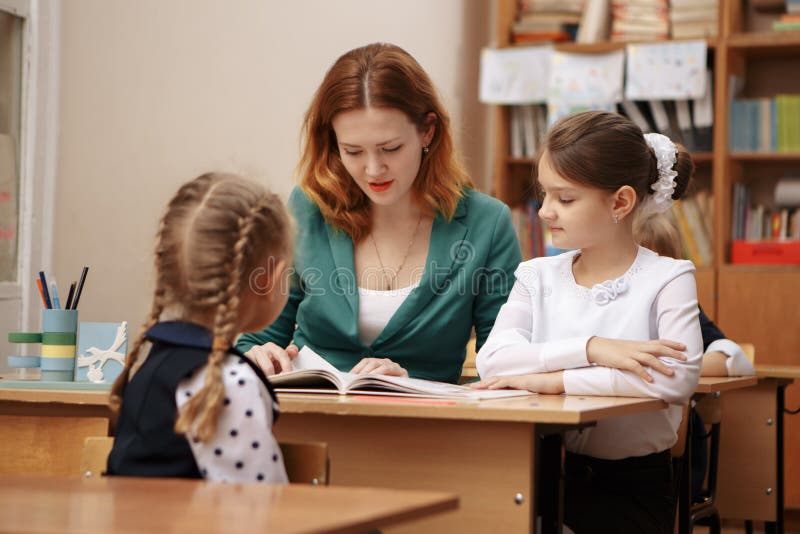 Student is Tutoring an Elementary School Stock Photo - Image of ...