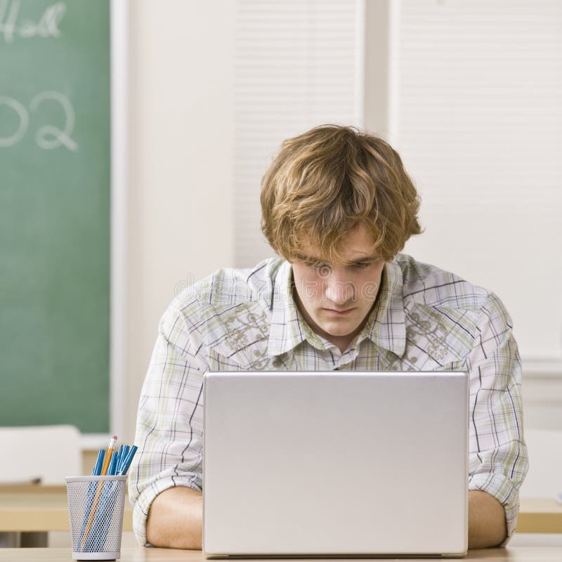 Student Typing on Laptop in Classroom Stock Photo - Image of education ...