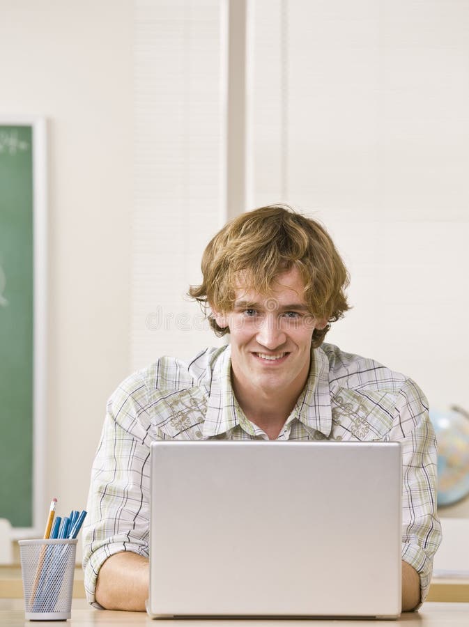 Student Typing on Laptop in Classroom Stock Photo - Image of education ...