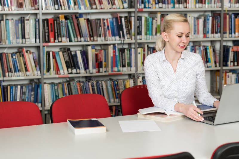 Student Typing on Laptop in the University Library Stock Photo - Image ...