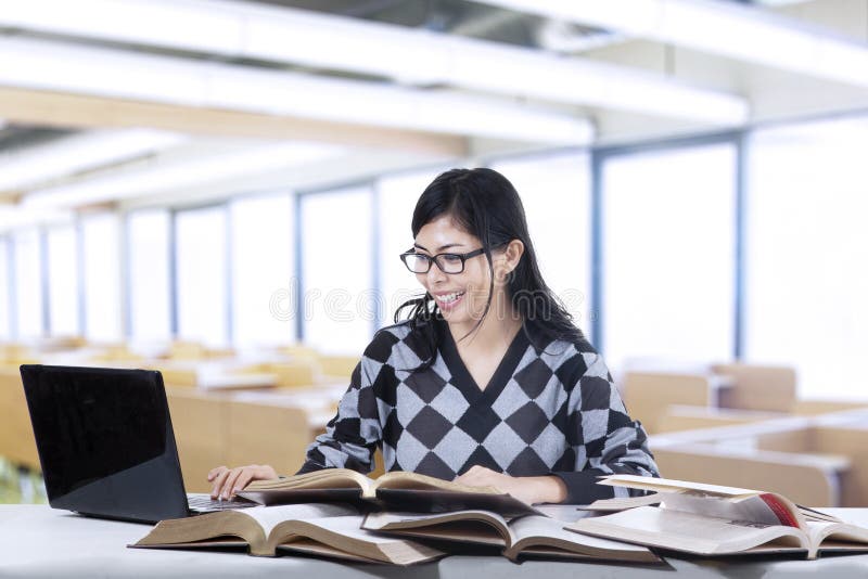 Student Typing the Source Book 2 Stock Image - Image of library ...
