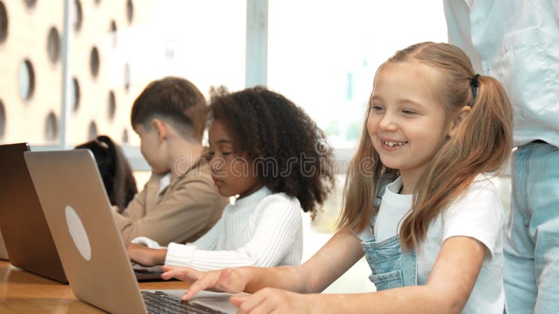 Student Use Laptop Writing Code while Teacher Explain about Program ...