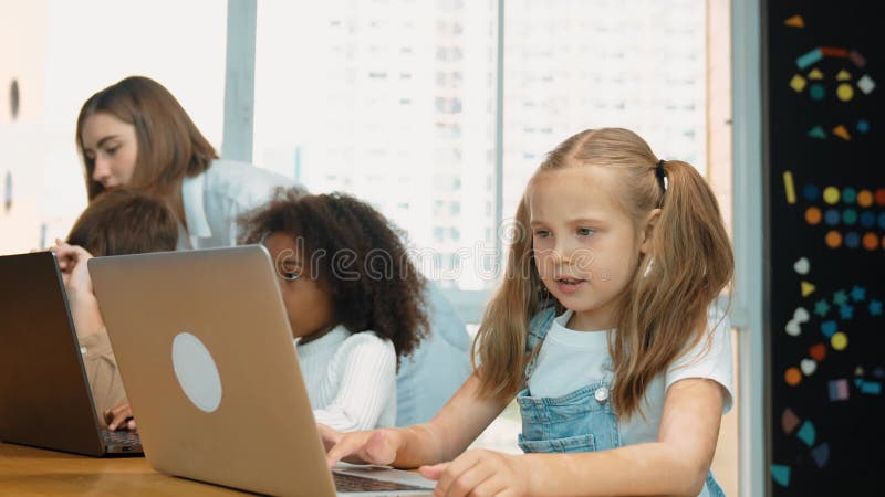 Student Use Laptop Writing Code while Teacher Explain about Program ...