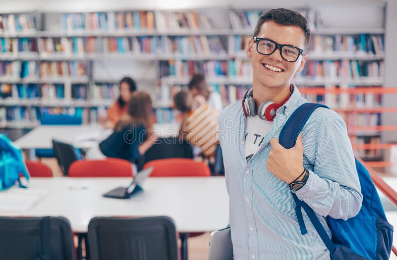 The Student Uses a Notebook, Latop and a School Library Stock Photo ...