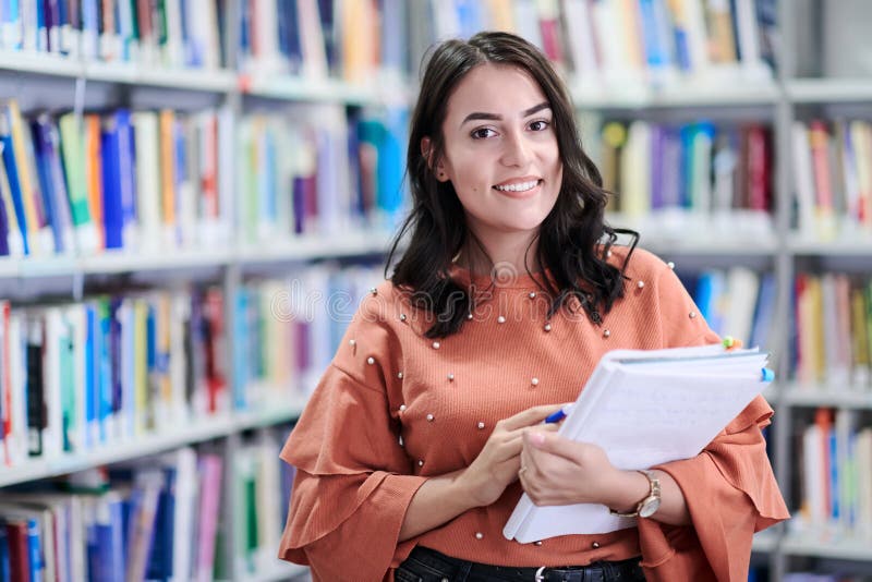 The Student Uses a Notebook and a School Library Stock Photo - Image of ...