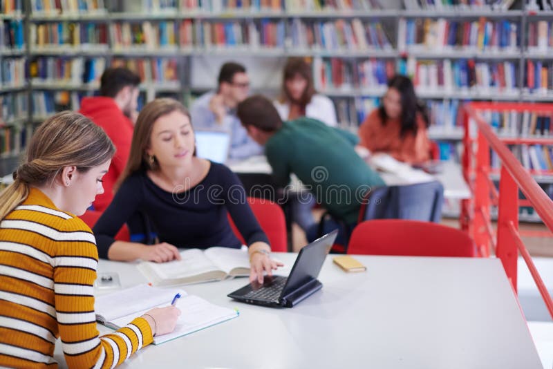 The Student Uses a Notebook and a School Library Stock Photo - Image of ...