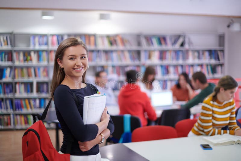 The Student Uses a Notebook and a School Library Stock Image - Image of ...