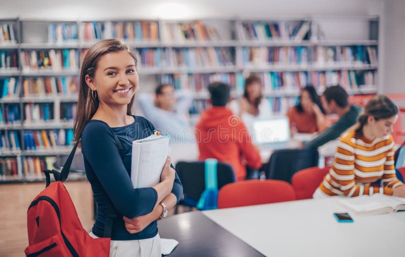 The Student Uses a Notebook and a School Library Stock Image - Image of ...