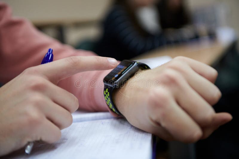 The Student Uses a Smartwatch in Math Class Stock Image - Image of ...