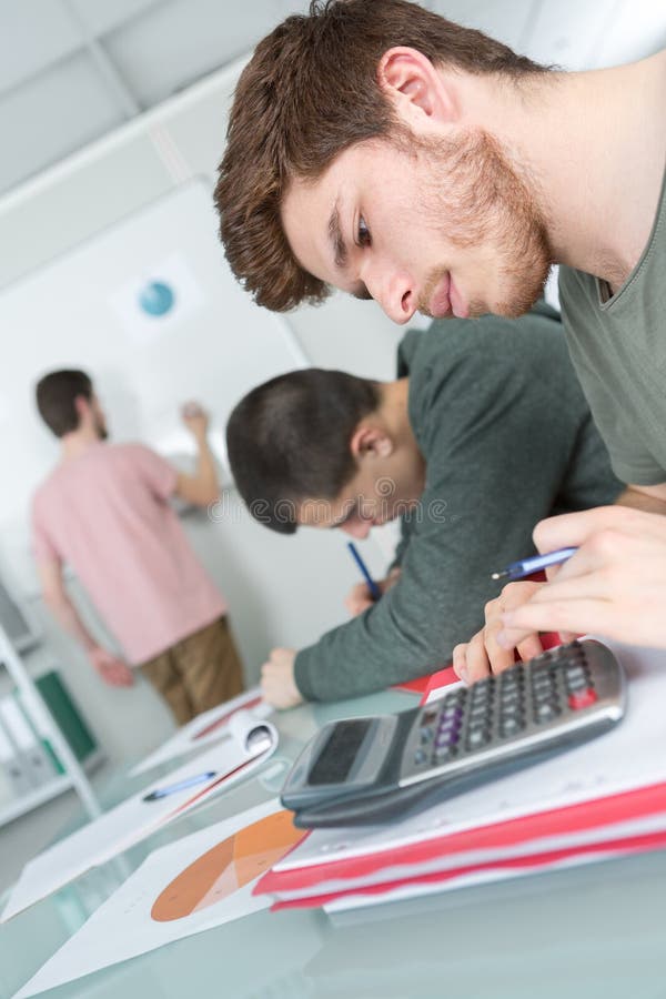 Student using calculator stock photo. Image of engineering - 173517630