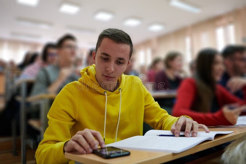 Student Using a Calculator while Calculating in a Math Class Stock ...