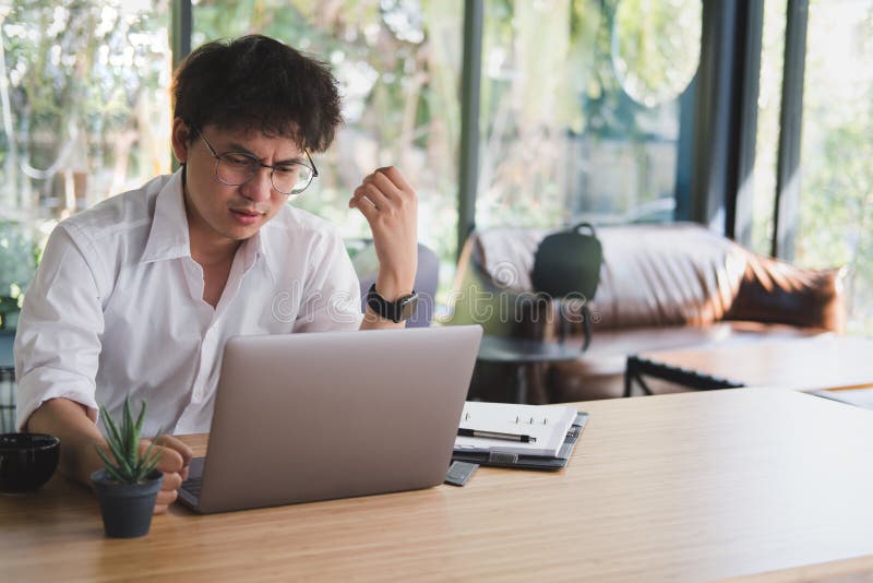 Student Using Computer for Learning Leasson Online at Cafe. Angry ...
