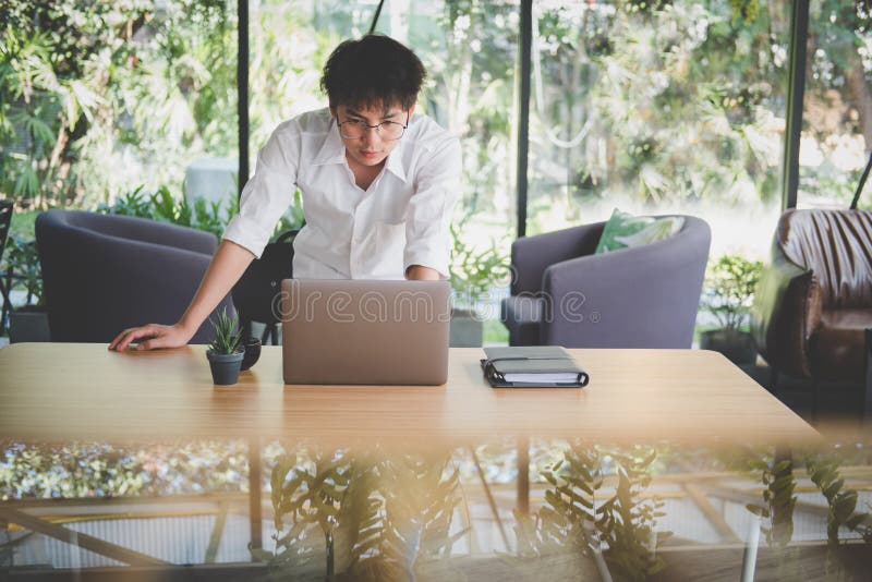 Student Using Computer for Learning Leasson Online at Cafe. Star Stock ...