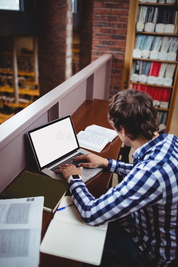 Student Using Laptop in Library Stock Photo - Image of education ...
