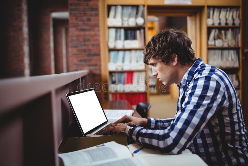 Student Using Laptop in Library Stock Image - Image of college, higher ...