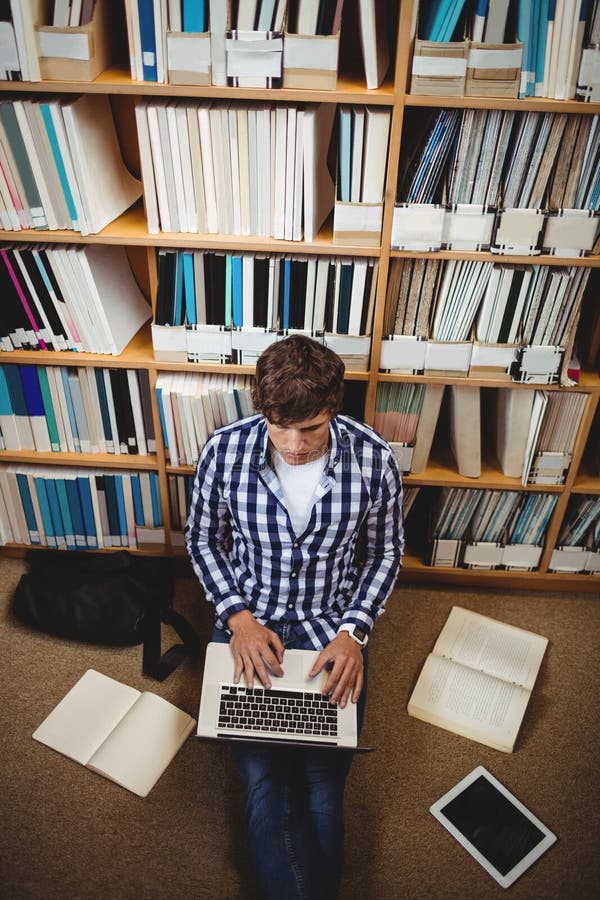 Student Using Laptop in Library Stock Photo - Image of education ...