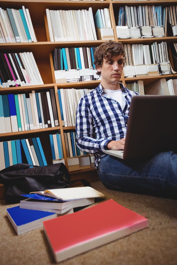 Student Using Laptop in Library Stock Photo - Image of casual ...