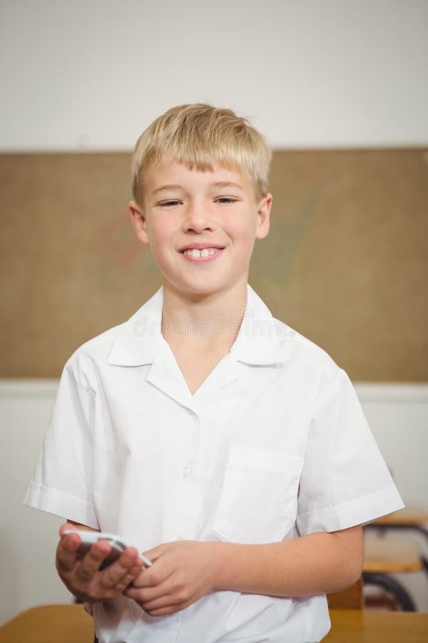 Student Using a Mobile Phone in Class Stock Photo - Image of desk ...